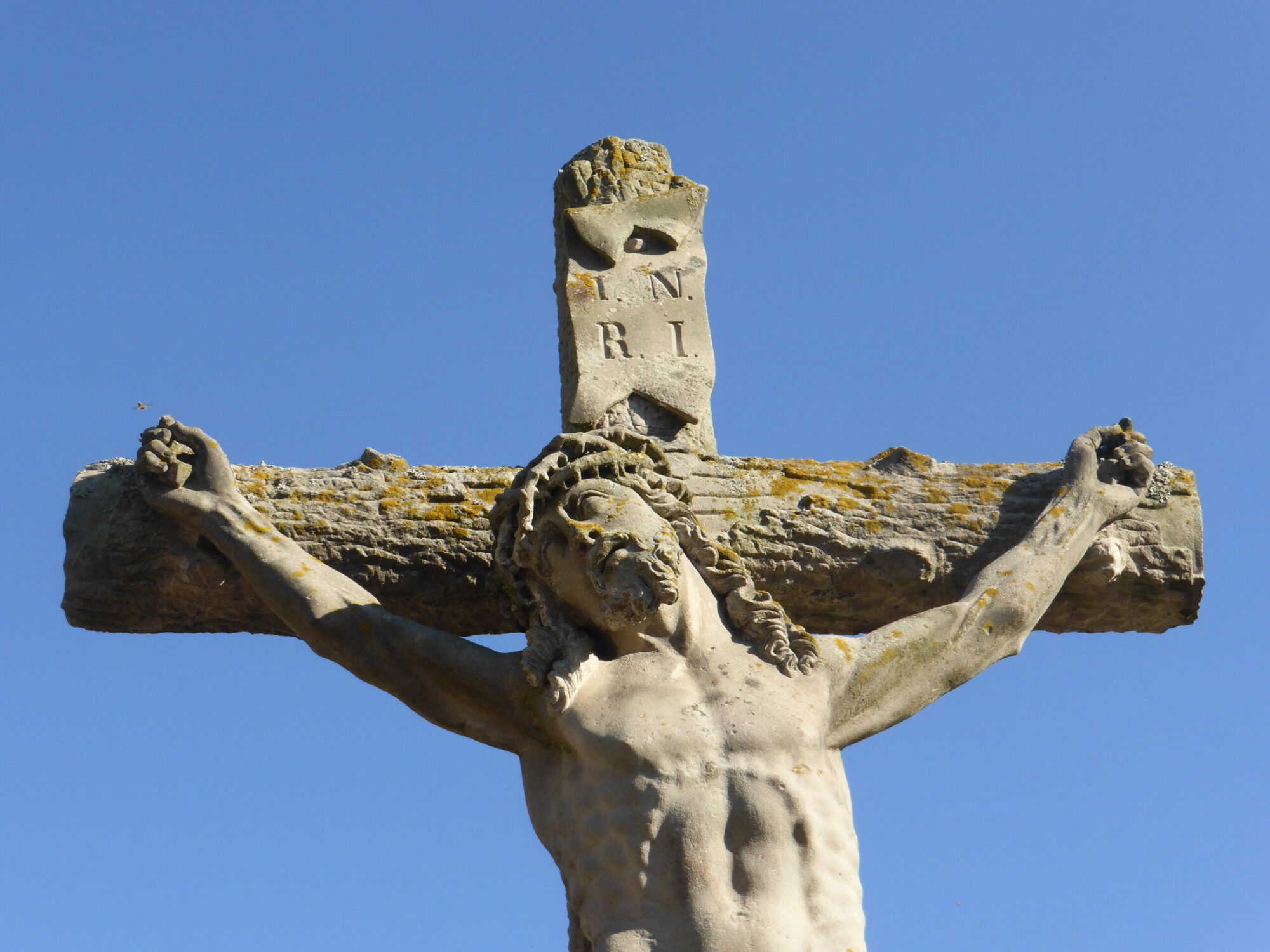 Tes bras en croix dans le ciel bleu | Poèmes